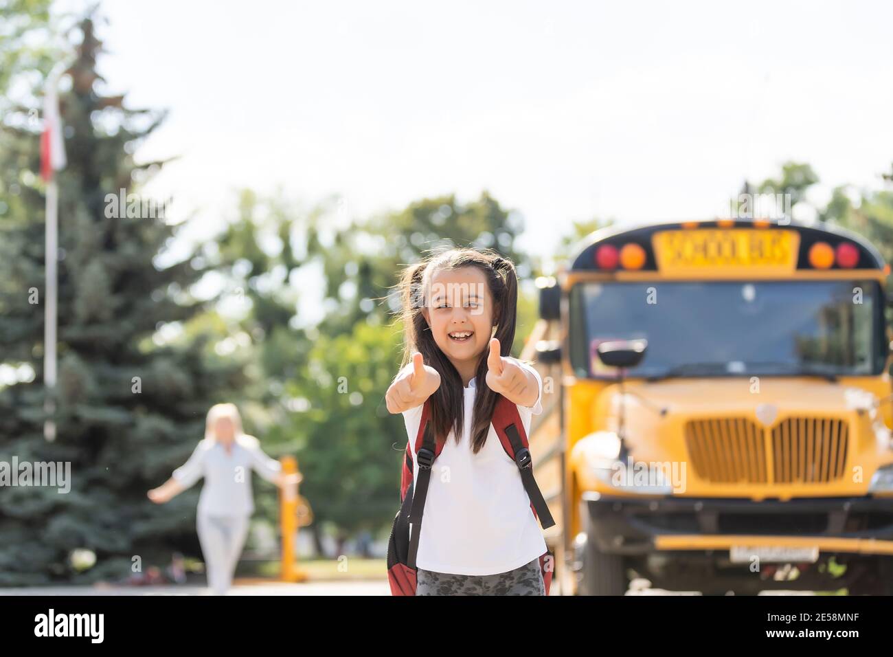 Kids student running into mother's hands to hug her after back to ...