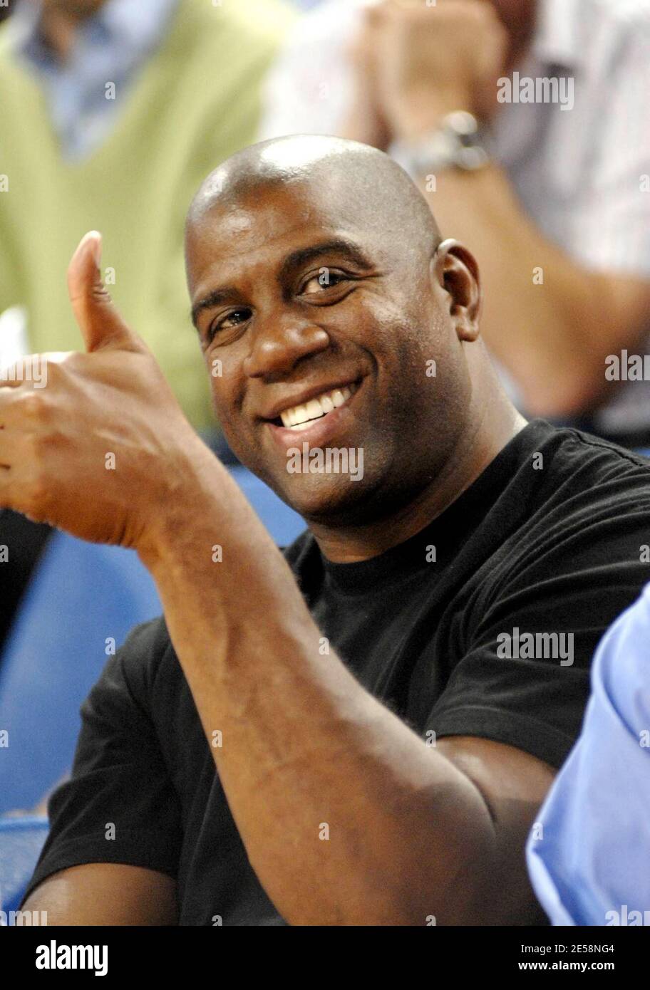 Magic Johnson is the honored guest at a charity basketball game in ...