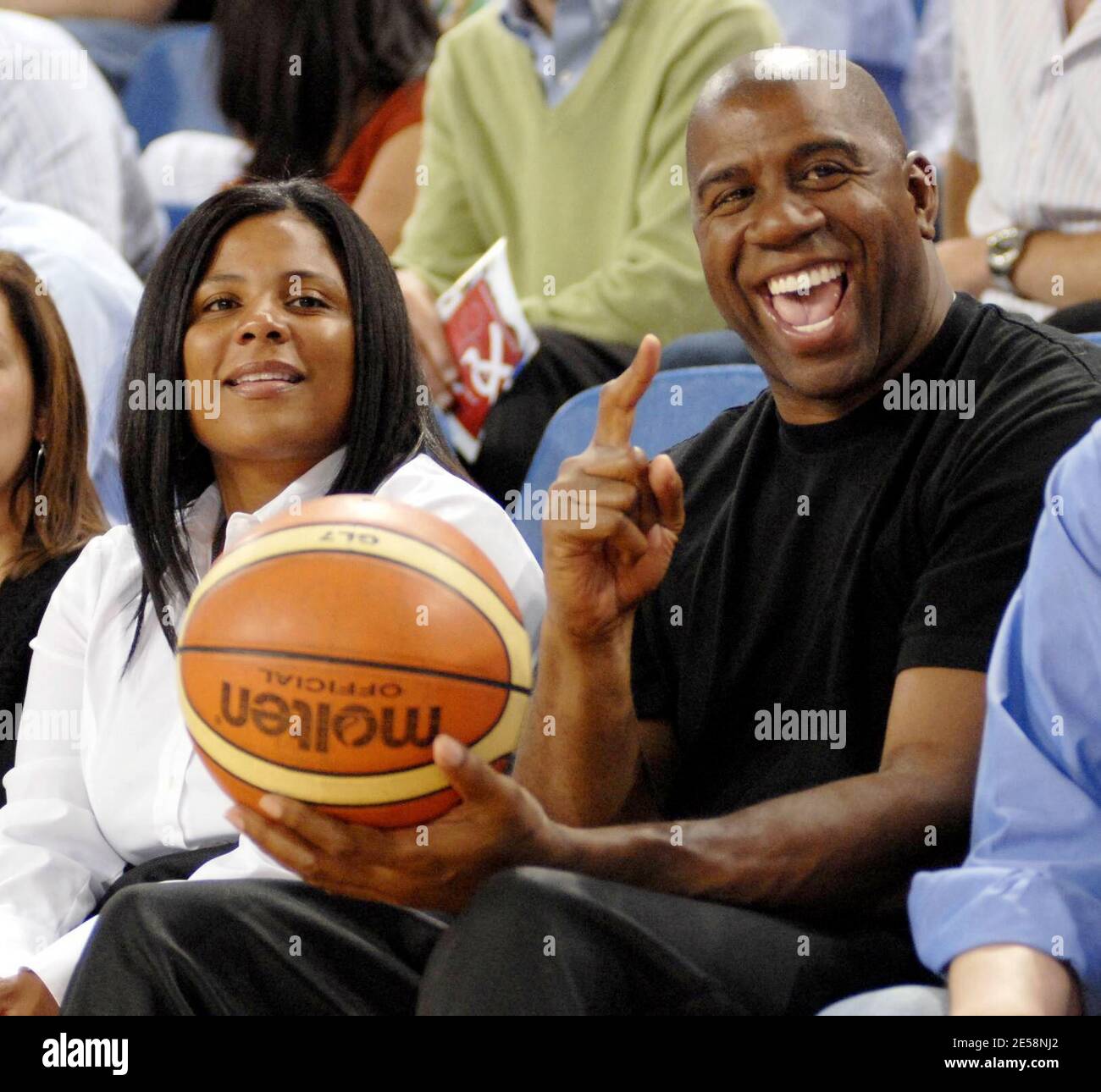 Magic Johnson is the honored guest at a charity basketball game in ...