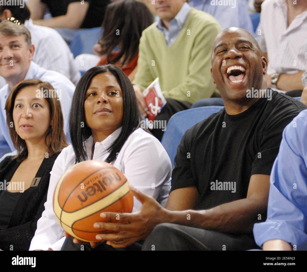 Magic Johnson is the honored guest at a charity basketball game in ...