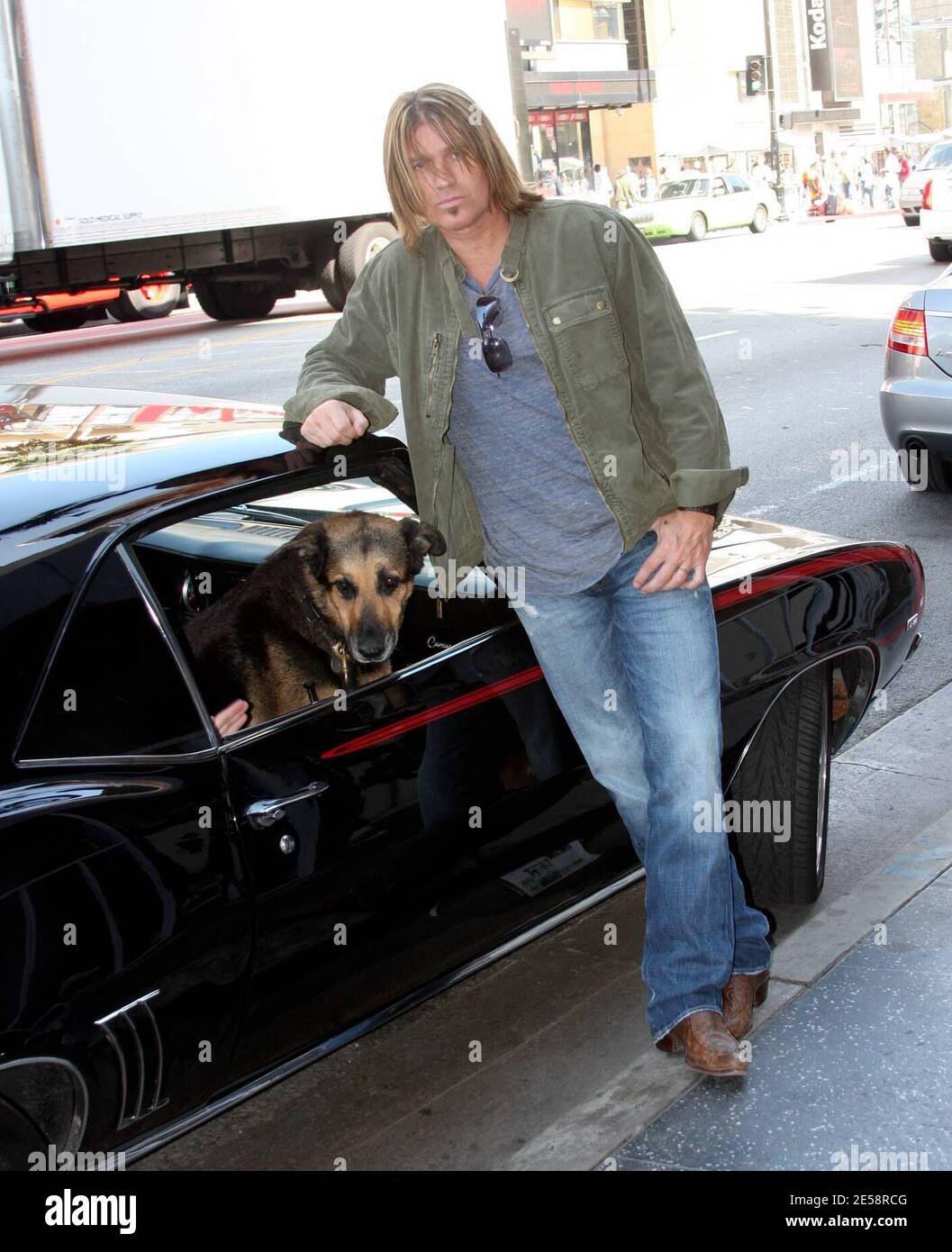 Billy Ray Cyrus poses up with his dog in Hollywood. His hound is ...