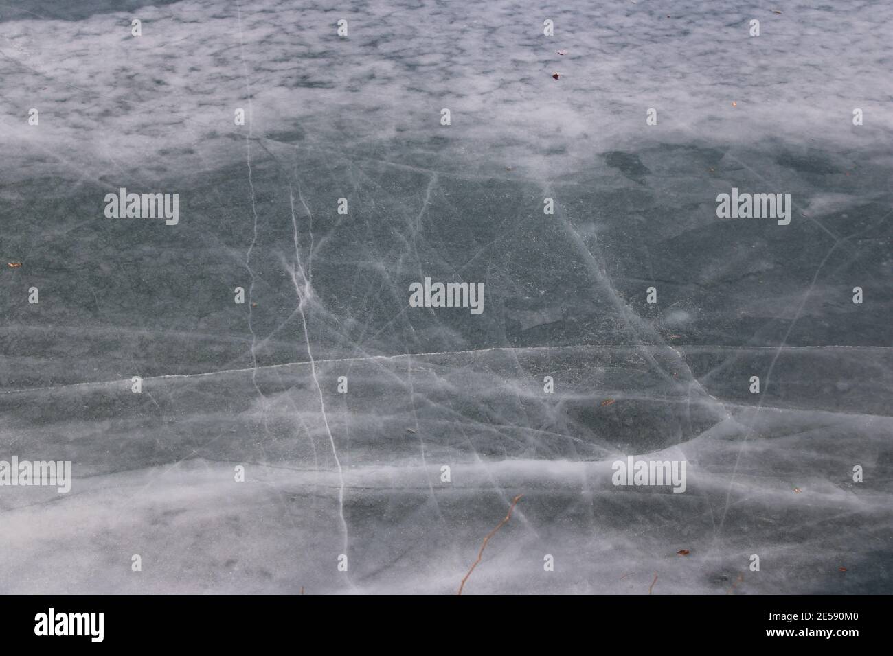 Dramatic marble-like patterns in frozen lake surface Stock Photo - Alamy