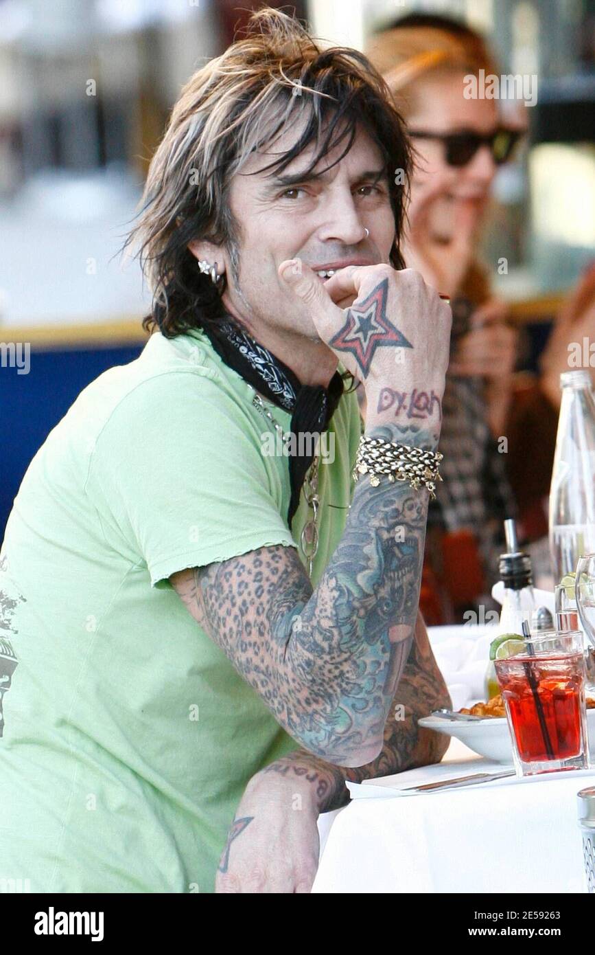 Exclusive!! Tommy Lee seems a bit agitated to see photographers as he ...