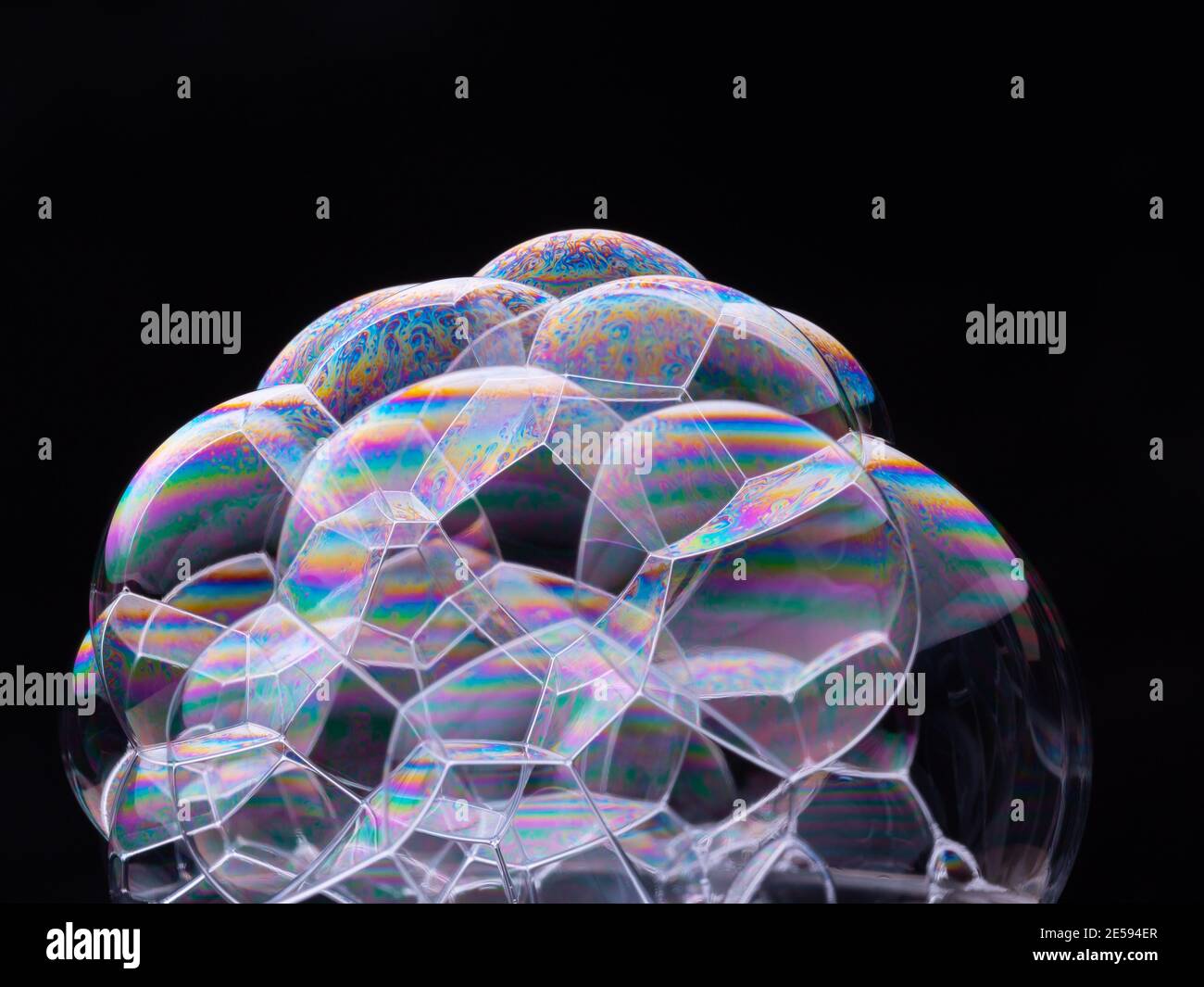 Structure from soap bubbles isolated on black background. Macro shot ...