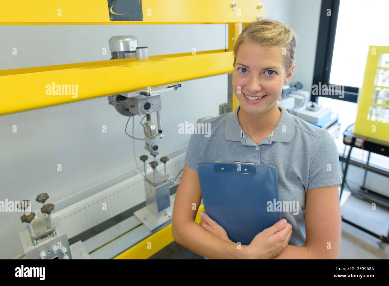 happy female operator during production Stock Photo - Alamy