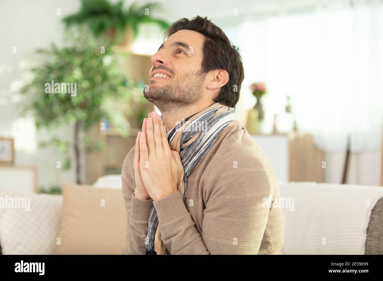 man thinking and praying at home Stock Photo - Alamy