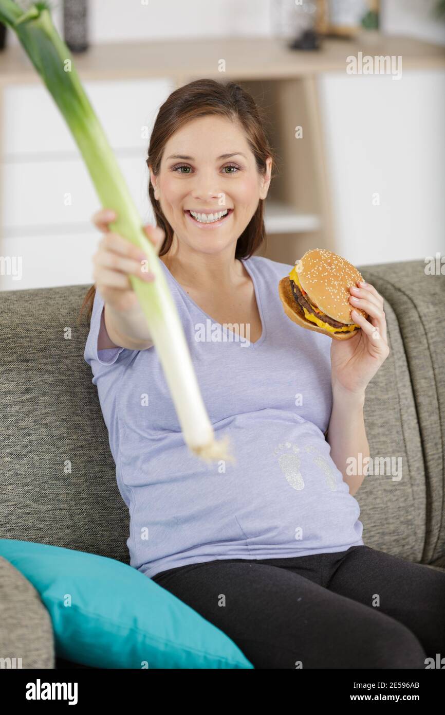 a pregnant woman chosing food Stock Photo - Alamy