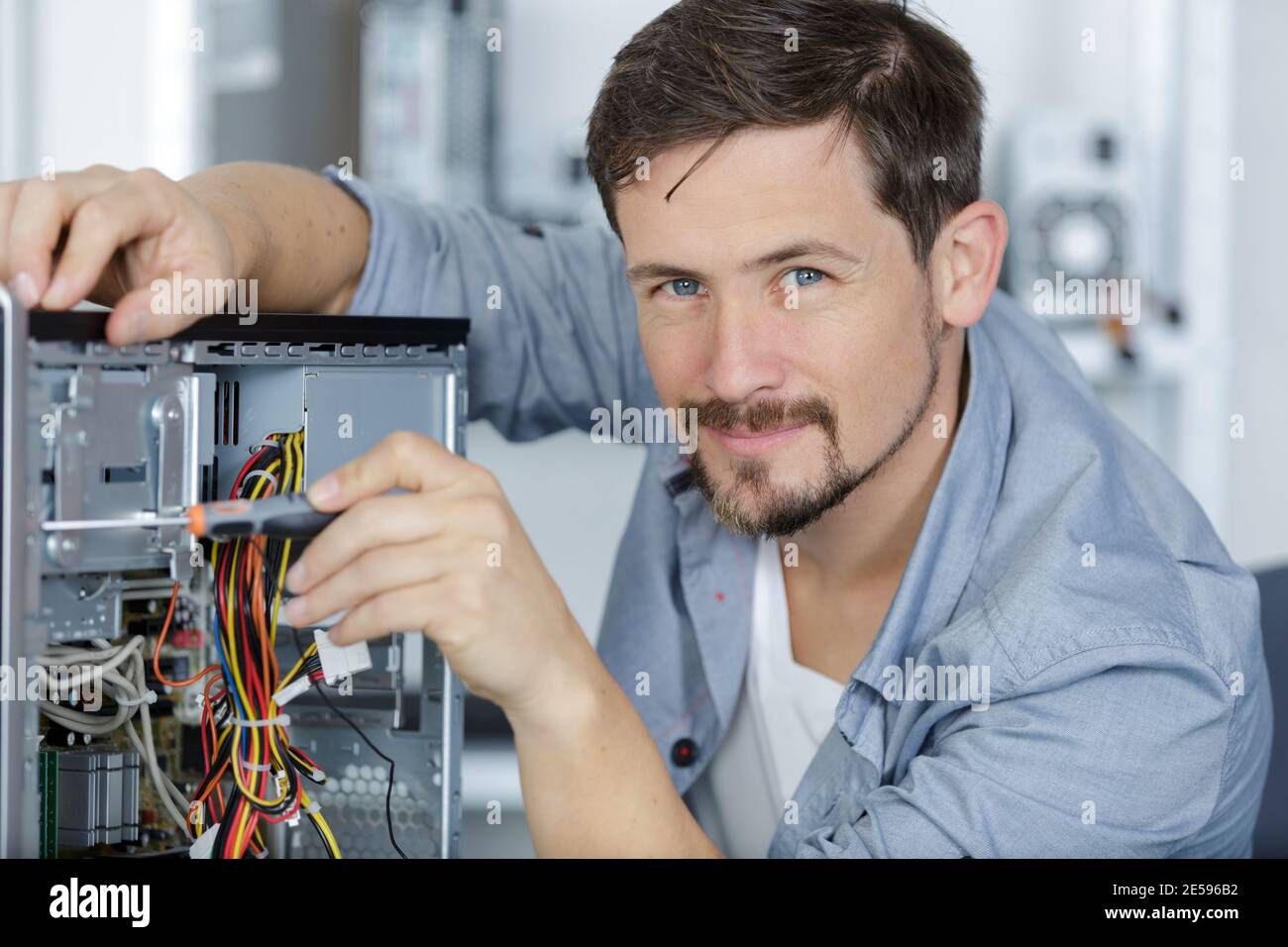 Computer engineer working on broken hi-res stock photography and images ...