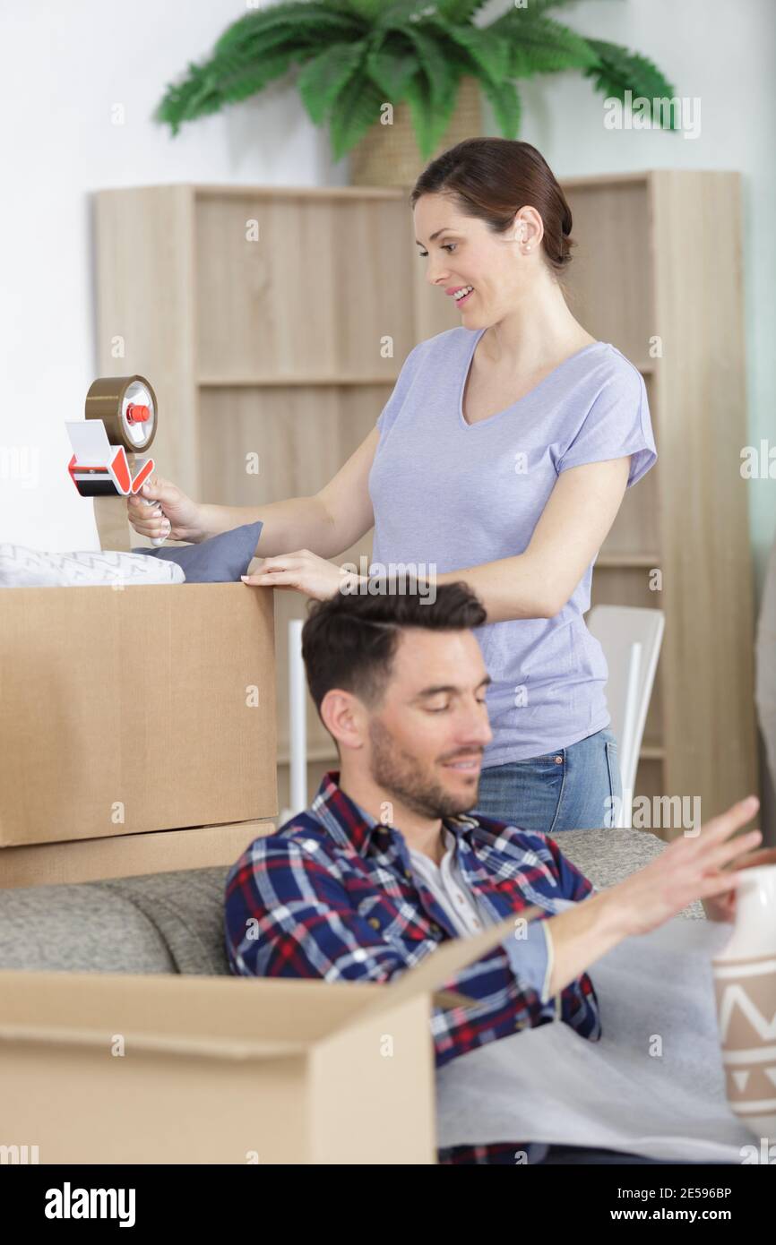 couple standing surrounded with cardboard boxes Stock Photo - Alamy