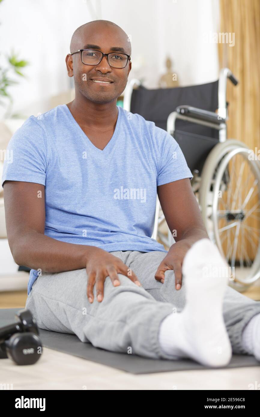 handicapped man on wheelchair working out Stock Photo - Alamy