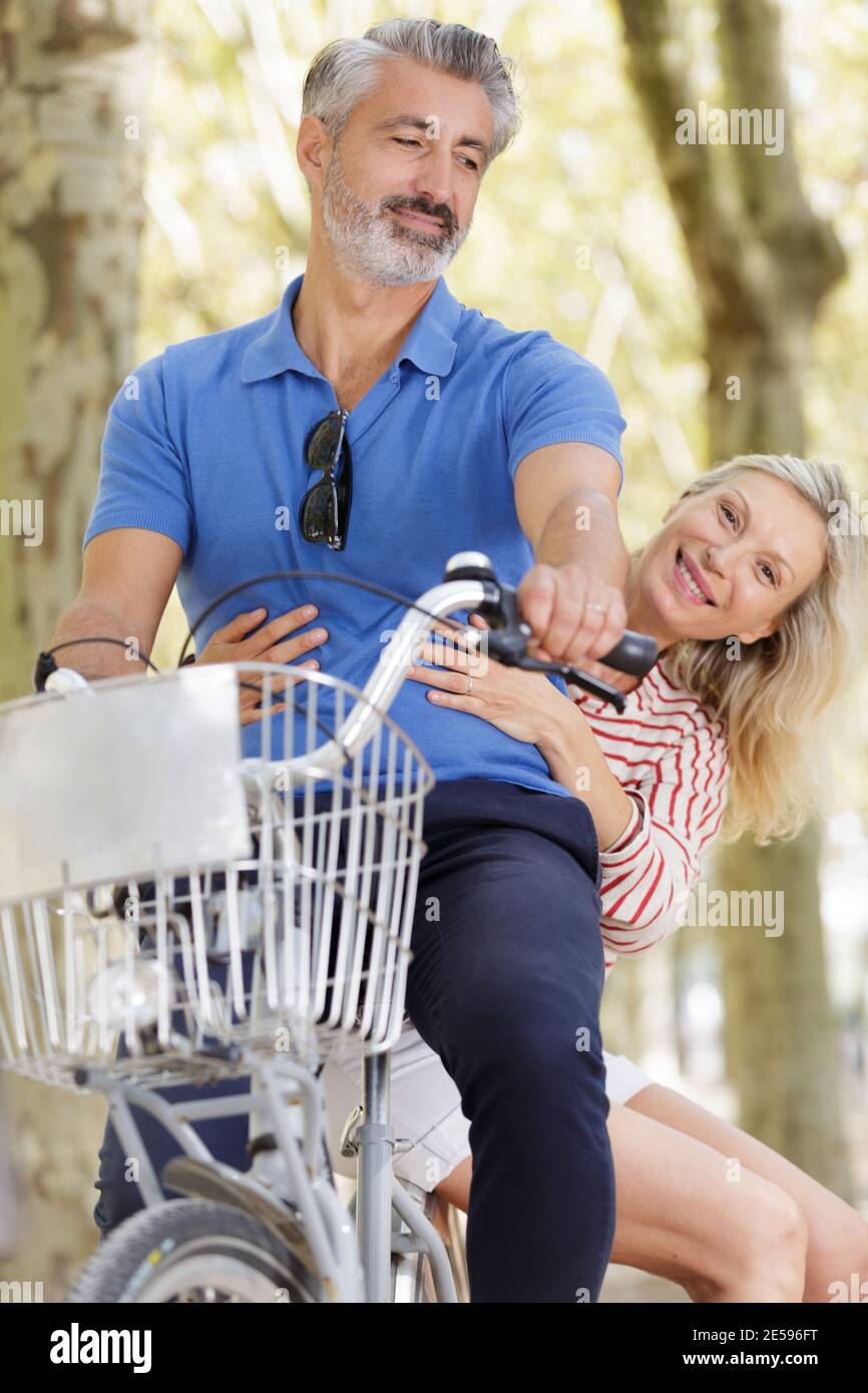 Sharing a bike hi-res stock photography and images - Alamy