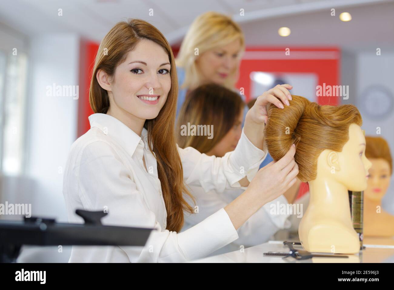 portrait of a professional hairdresser at training Stock Photo - Alamy