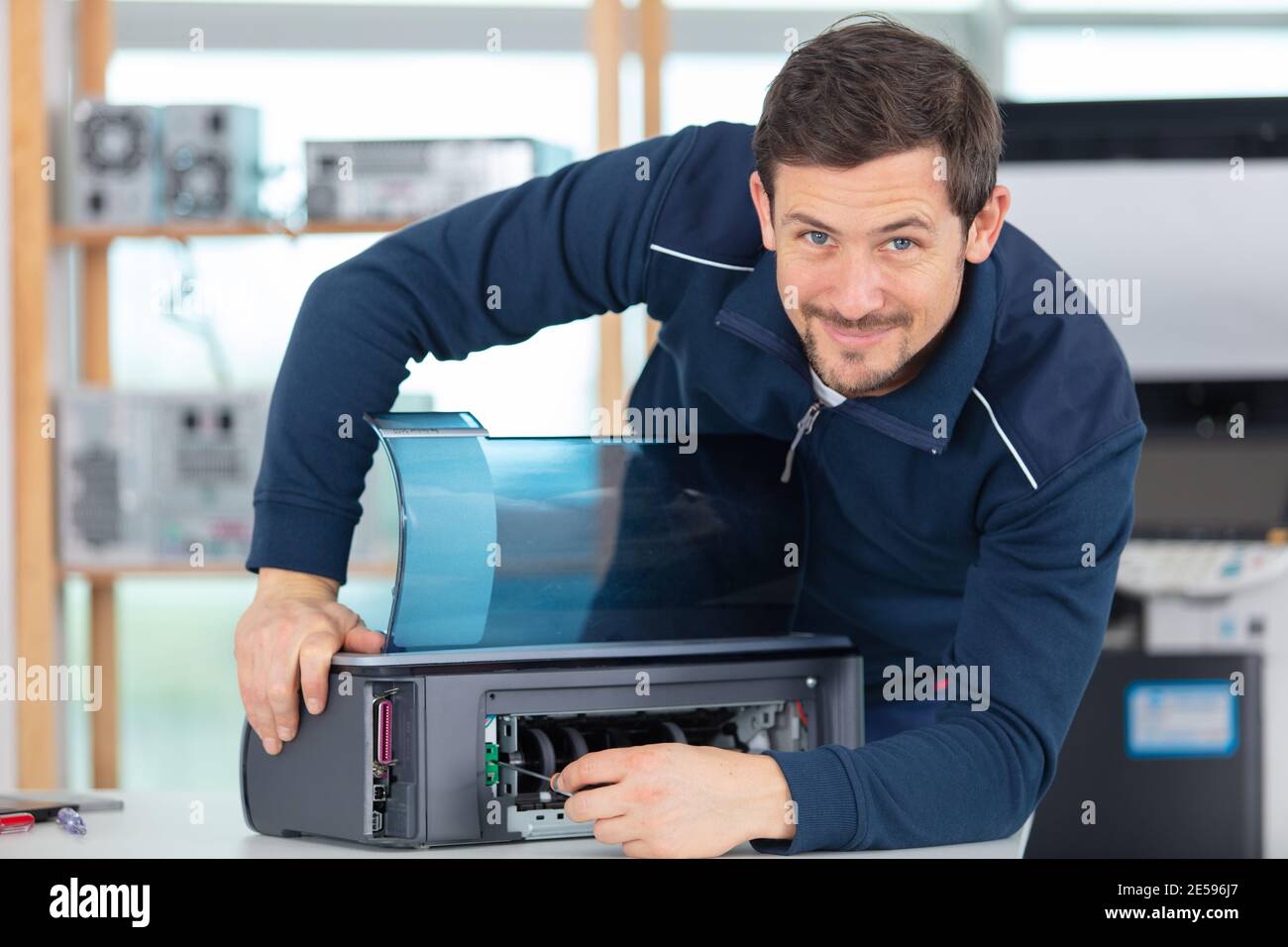 Technician repairing printer hi-res stock photography and images - Alamy