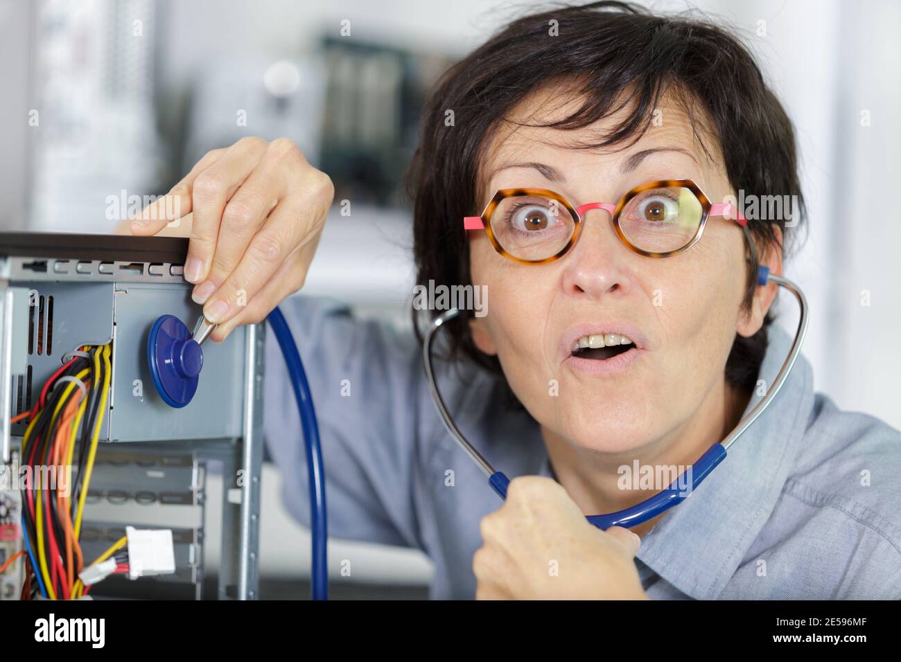 excited woman repairing a pc Stock Photo - Alamy
