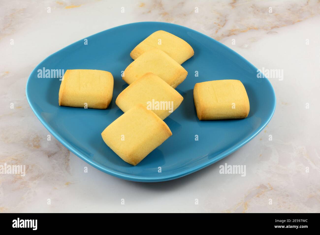 Rectangular shortbread cookies snack on blue dessert plate on table ...