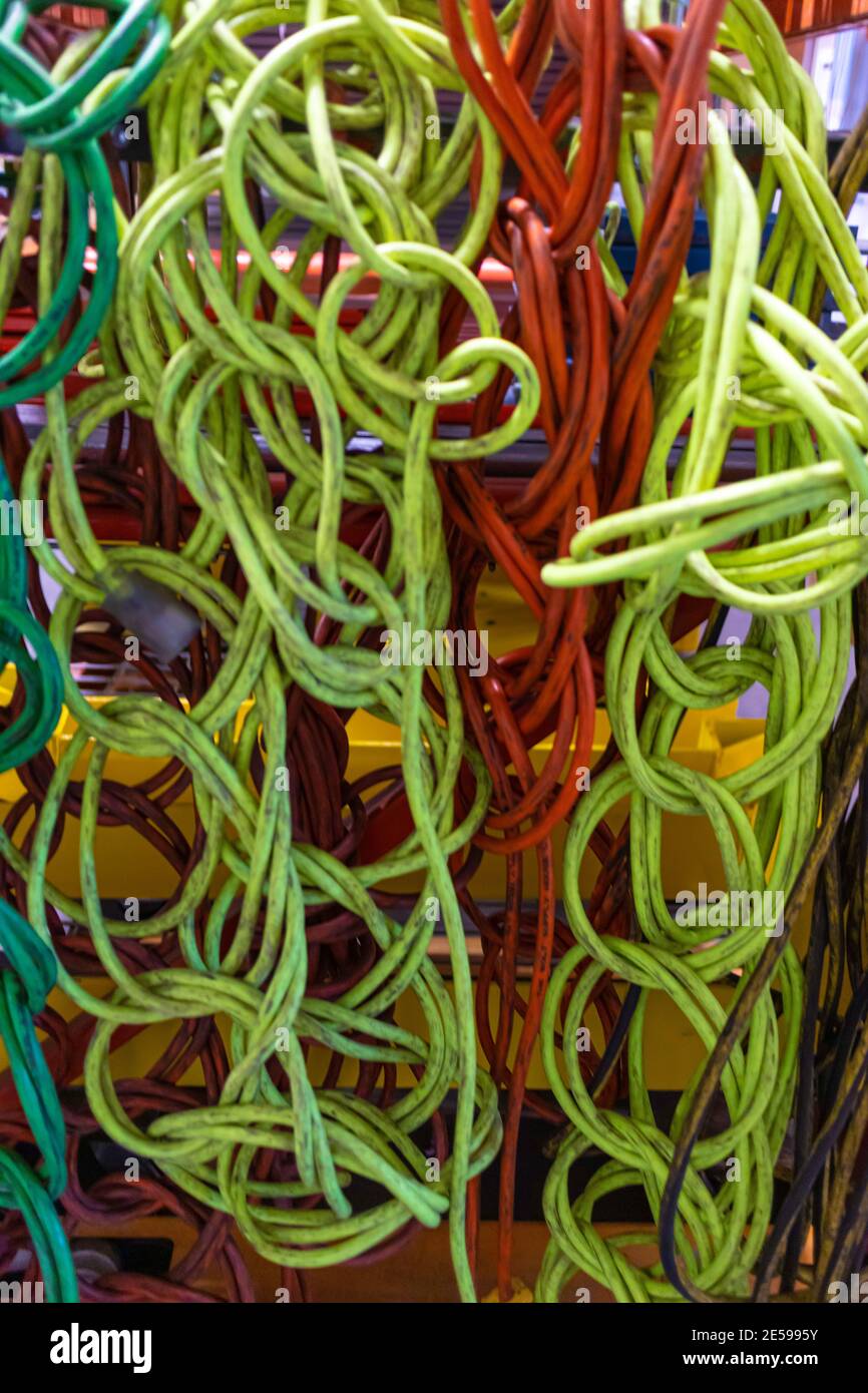 Electric Power Cables hanging on factory shelving Stock Photo - Alamy
