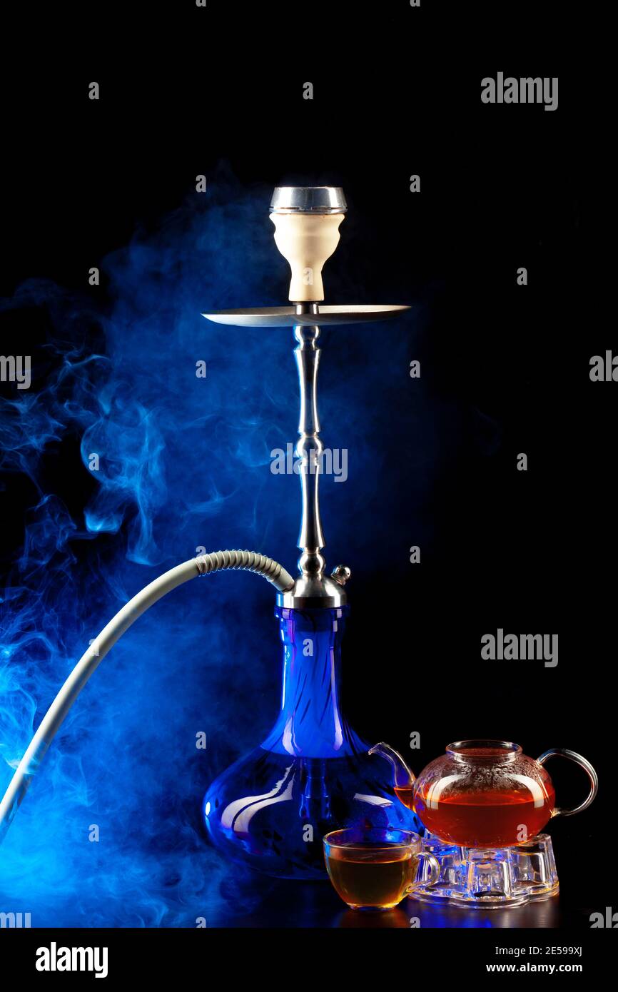 Modern shisha and glass teapot on black background Stock Photo - Alamy