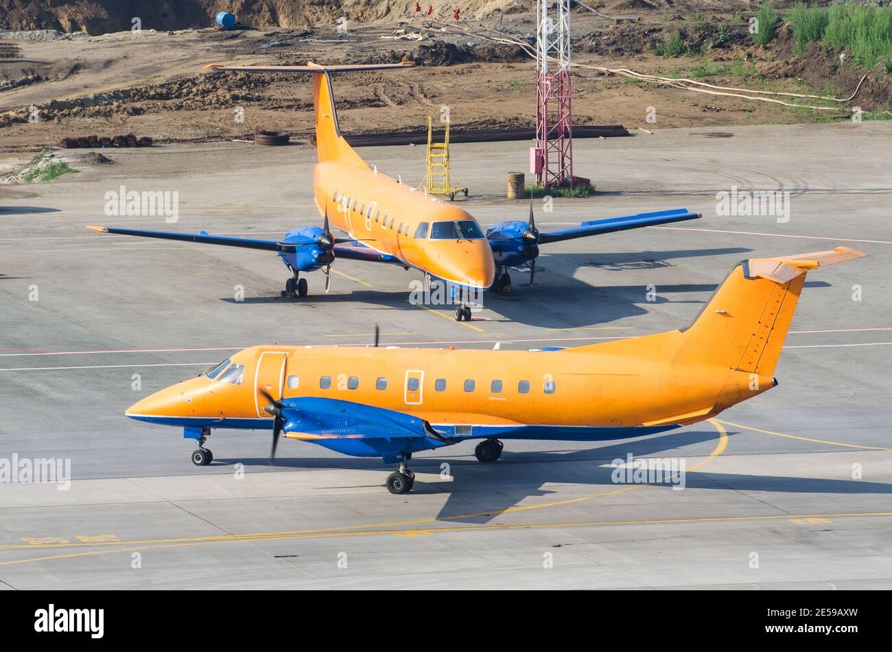 Two identical aircraft parked at the airport Stock Photo - Alamy