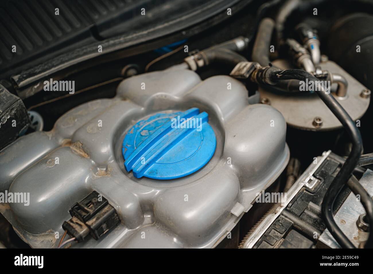 Dirty engine under the hood of a car Stock Photo - Alamy