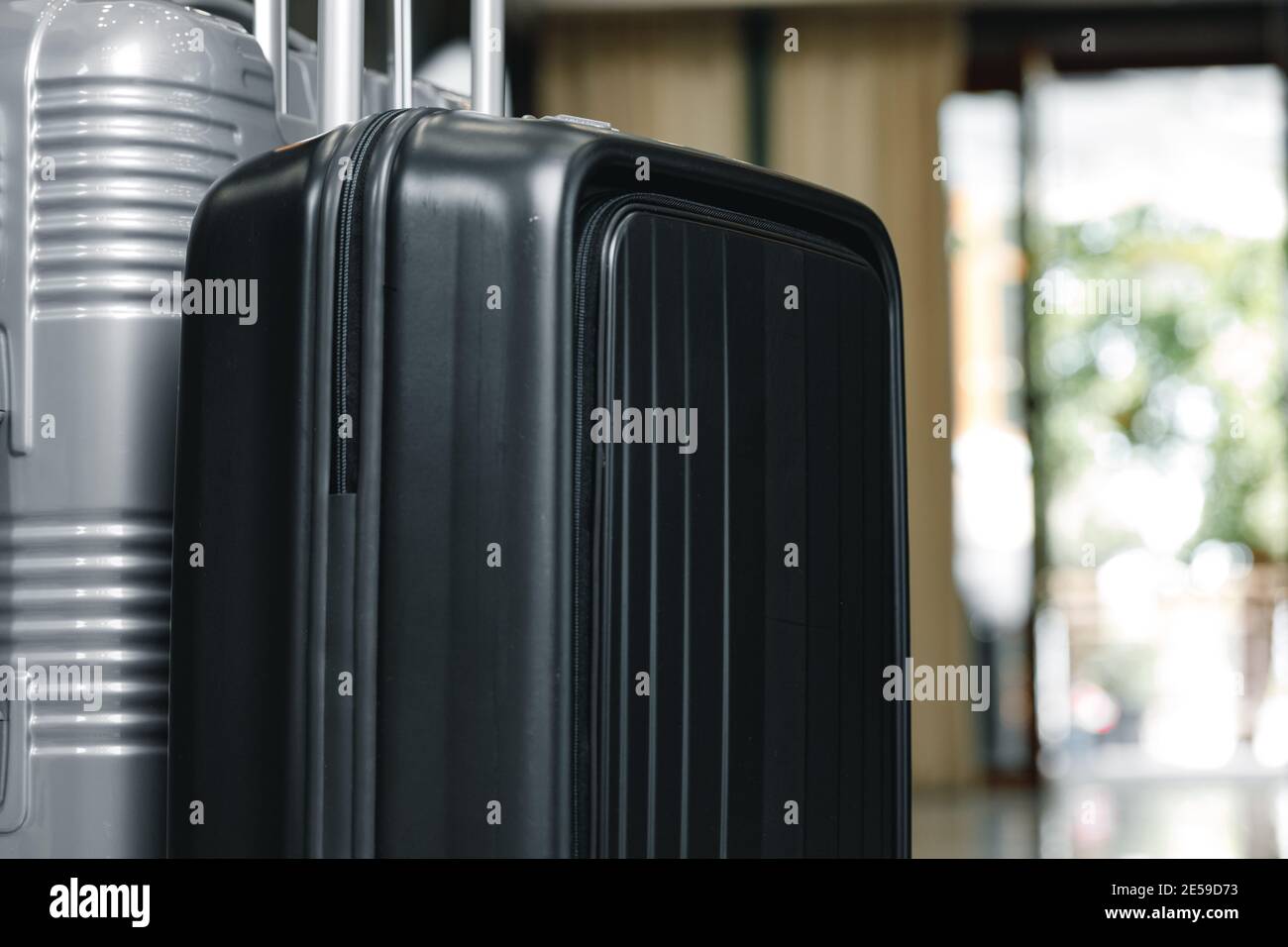 Luggage suitcase for trips standing in hotel lobby Stock Photo - Alamy