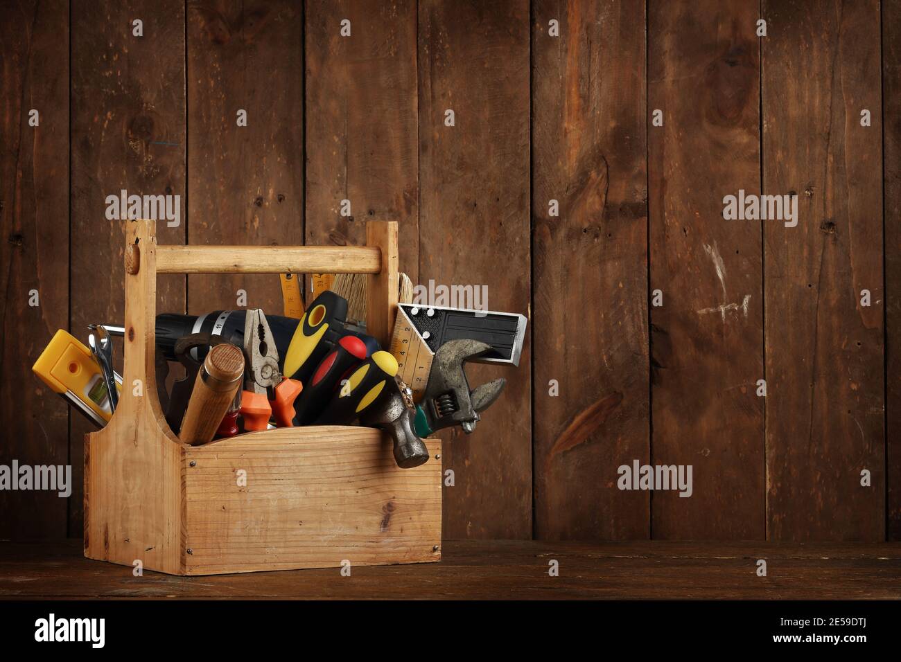 wooden toolbox with tools over wood Stock Photo - Alamy