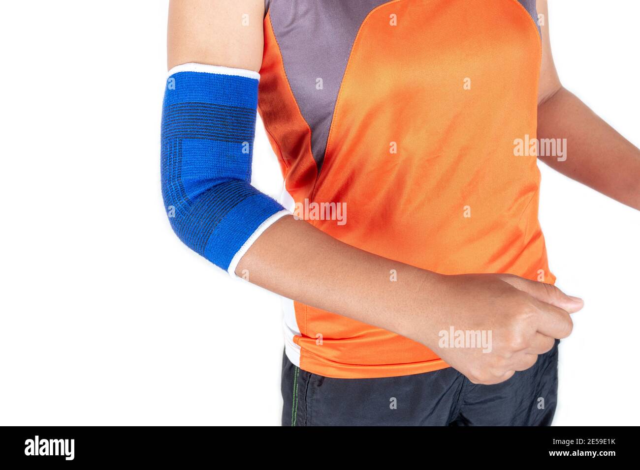 Female wearing elbow support because of injury from exercise, health ...