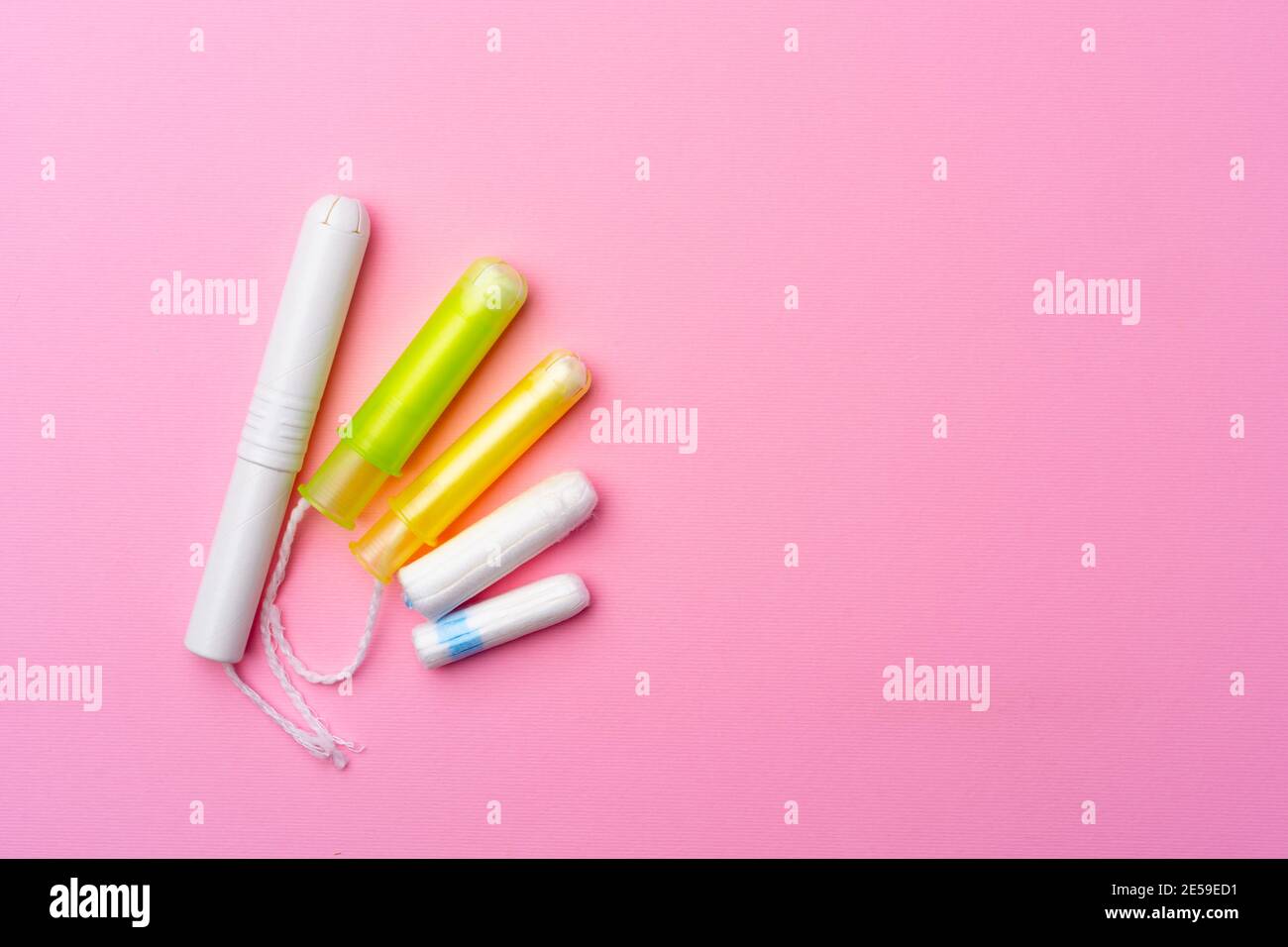 Hygienic female tampon on a pink background Stock Photo - Alamy