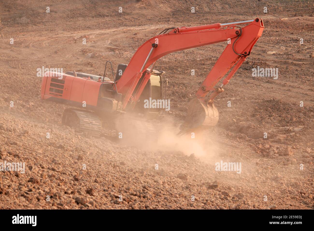 Orange excavator Under construction Large reservoir, Dust by digging ...