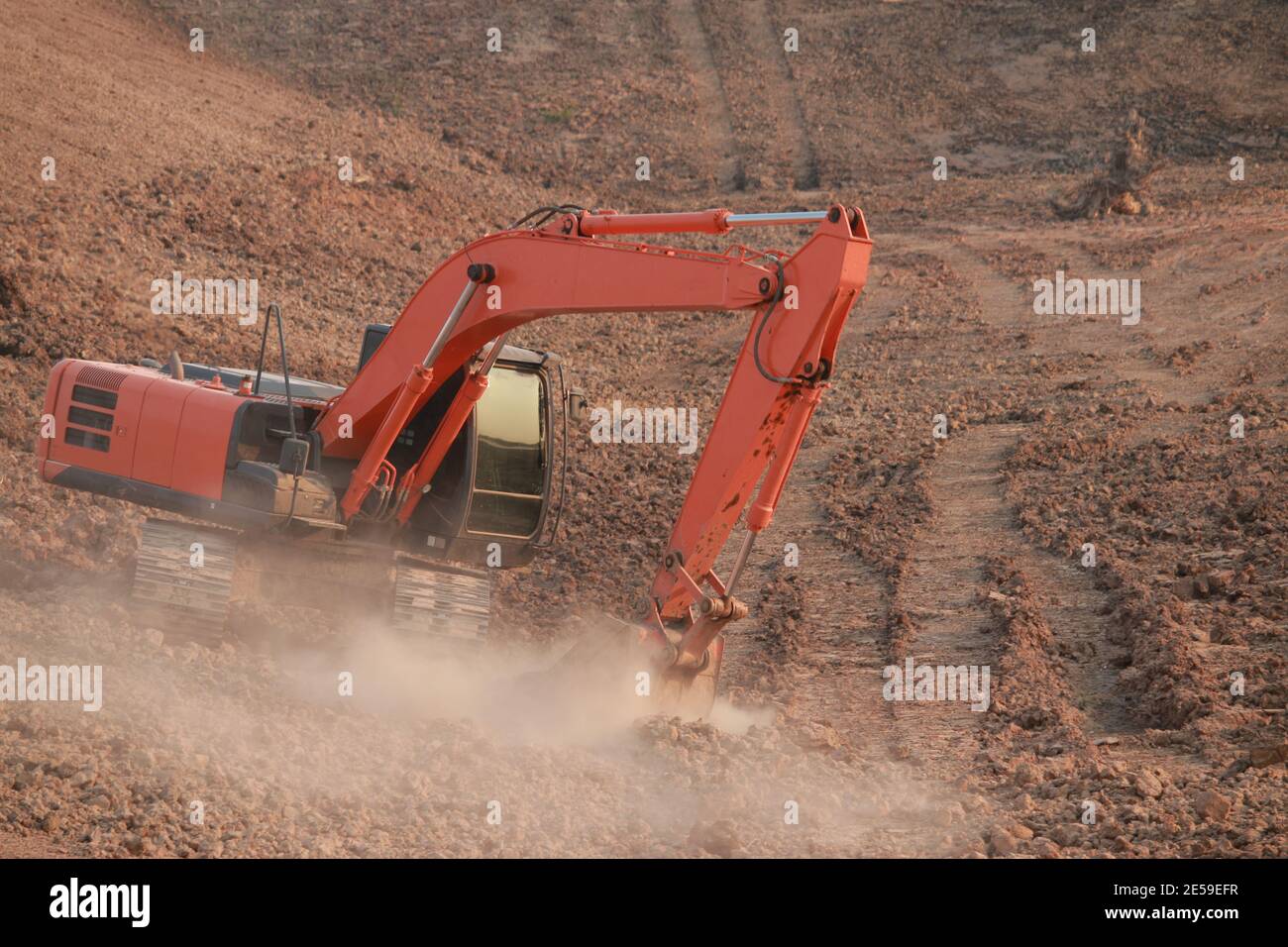 Orange excavator Under construction Large reservoir, Dust by digging ...