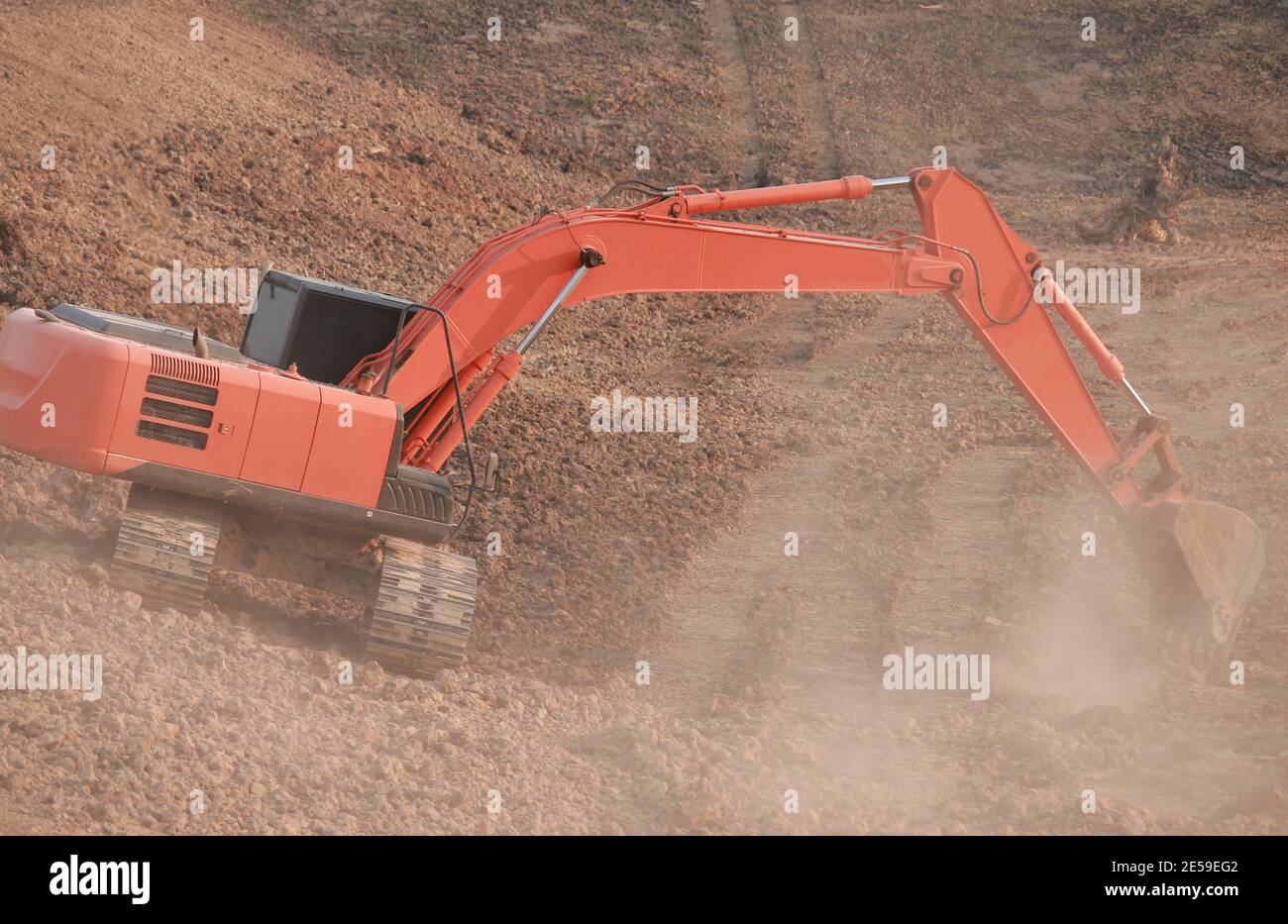 Orange excavator Under construction Large reservoir, Dust by digging ...