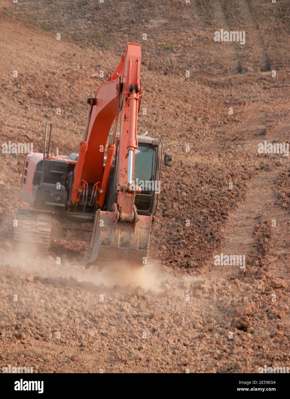 Orange excavator Under construction Large reservoir, Dust by digging ...