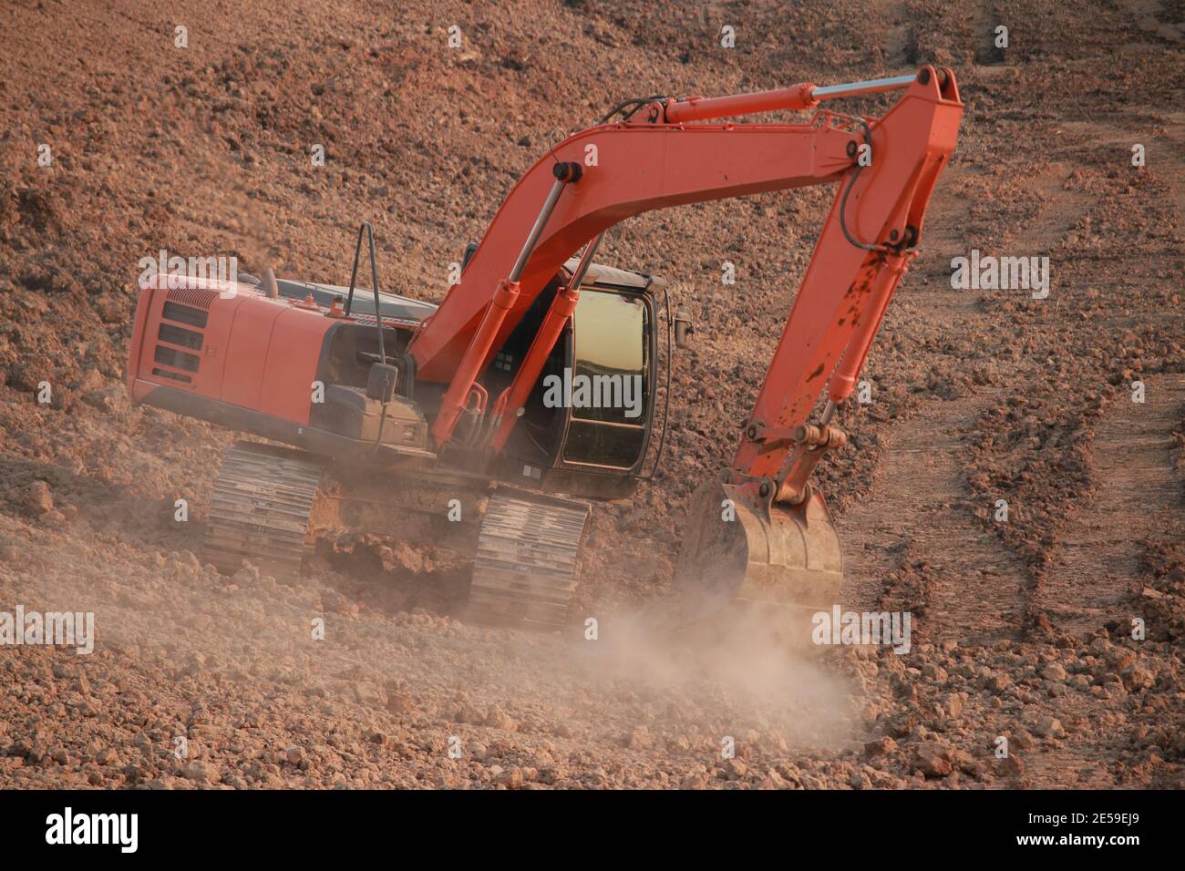 Orange excavator Under construction Large reservoir, Dust by digging ...
