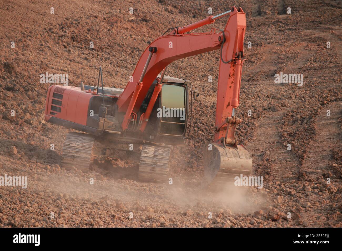 Orange excavator Under construction Large reservoir, Dust by digging ...