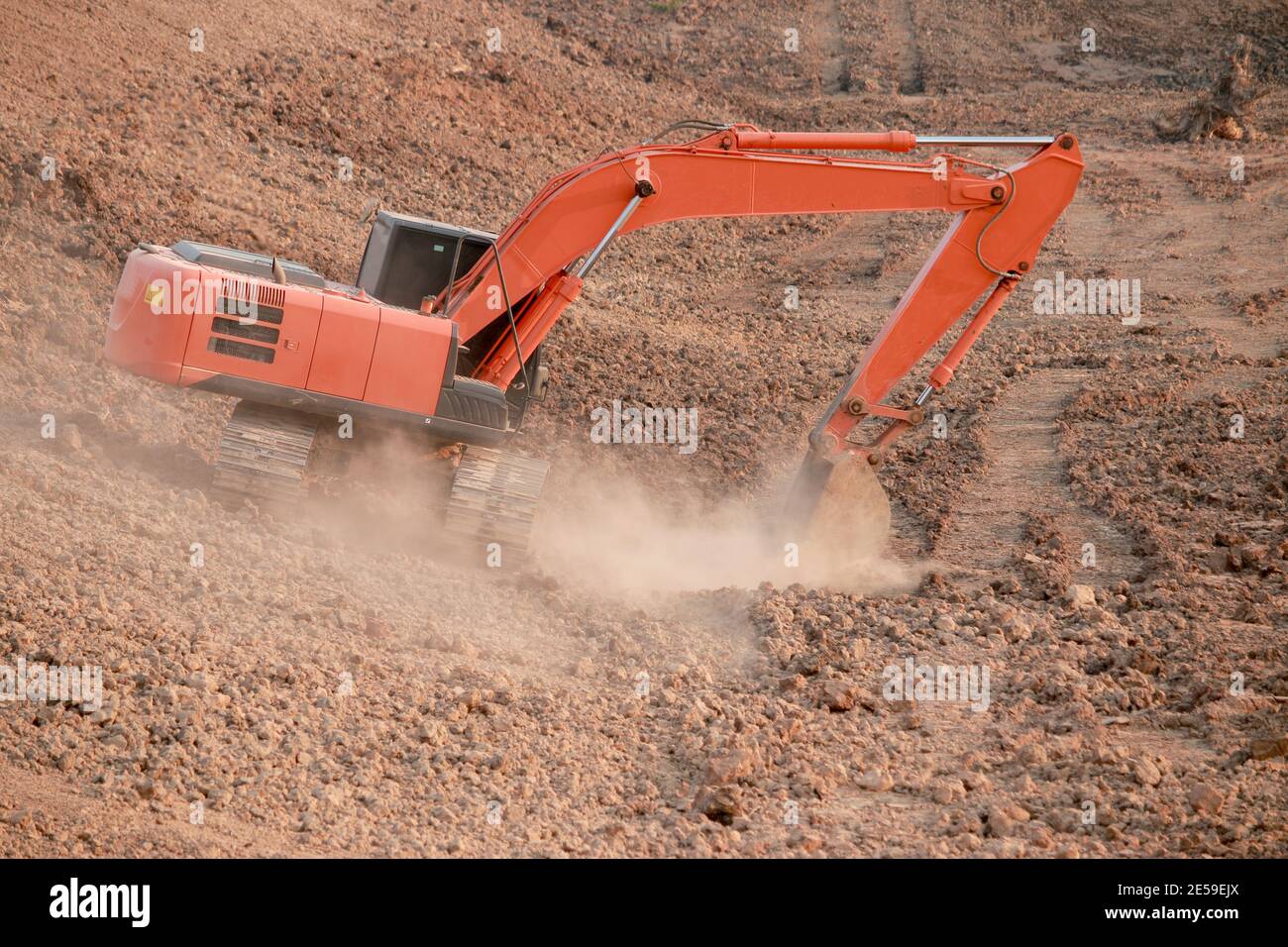 Orange excavator Under construction Large reservoir, Dust by digging ...