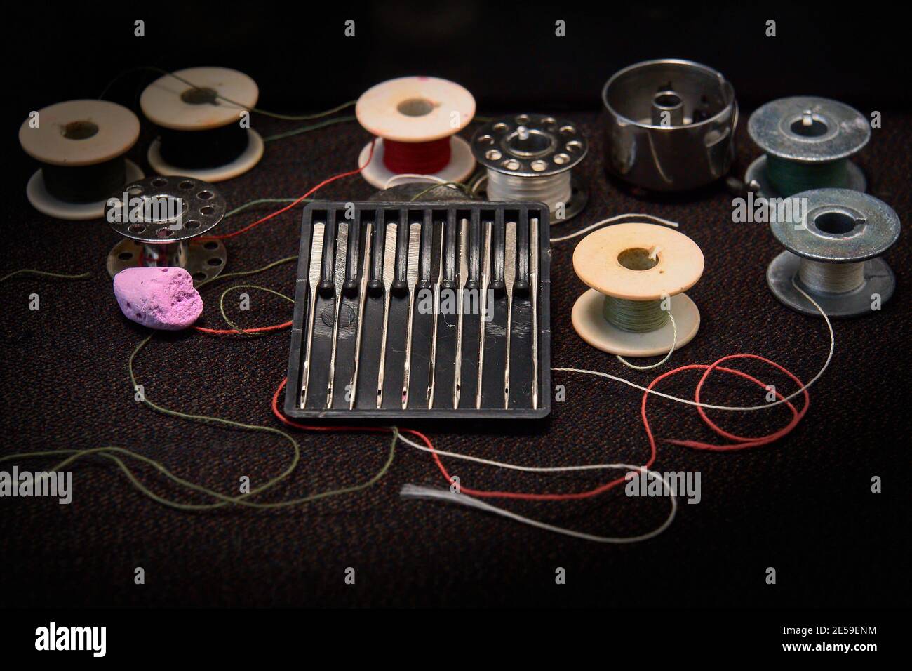 Set of needles and threads for a sewing machine Stock Photo - Alamy