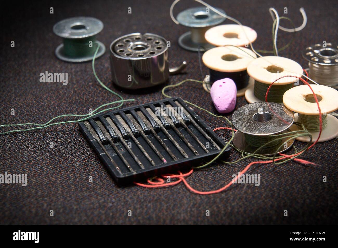 Set of needles and threads for a sewing machine Stock Photo - Alamy