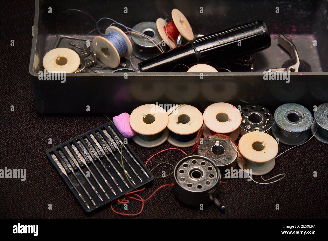Box with spools of thread with needles for a sewing machine Stock Photo ...