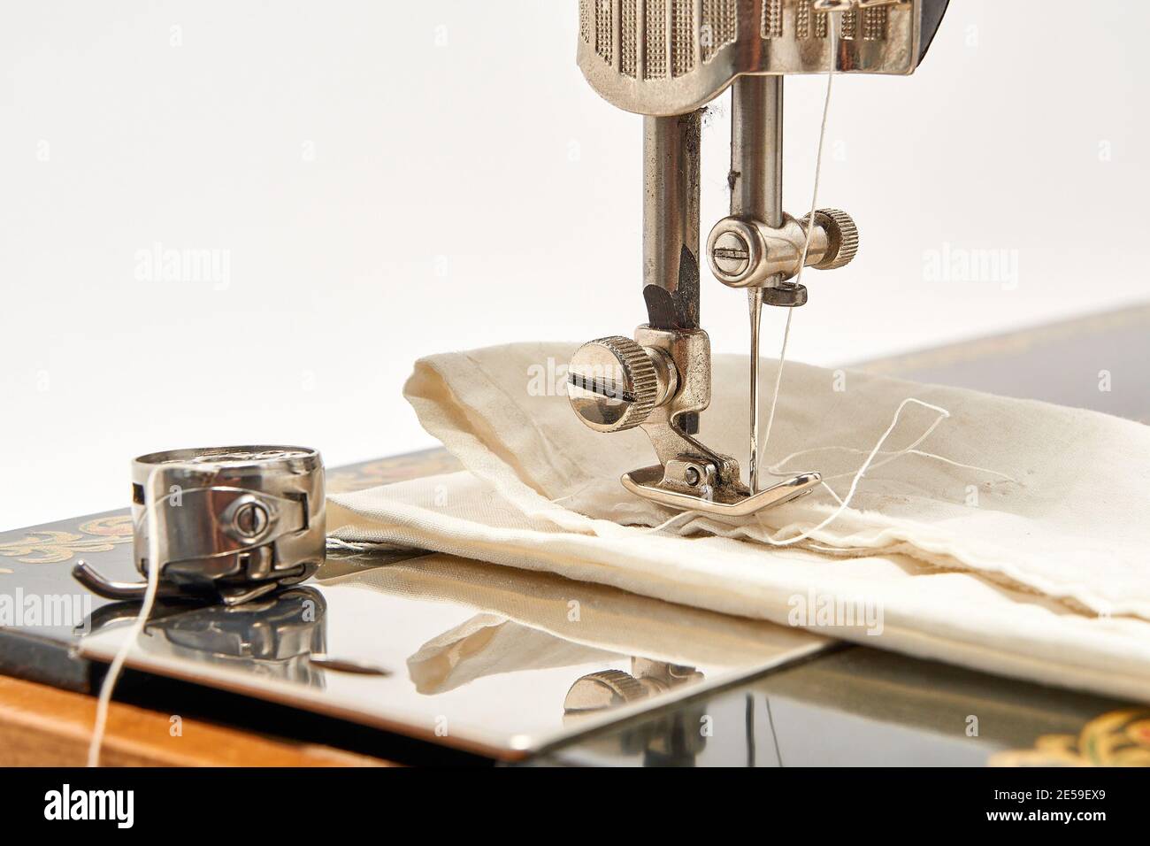 Sewing machine and parts on a white background Stock Photo - Alamy