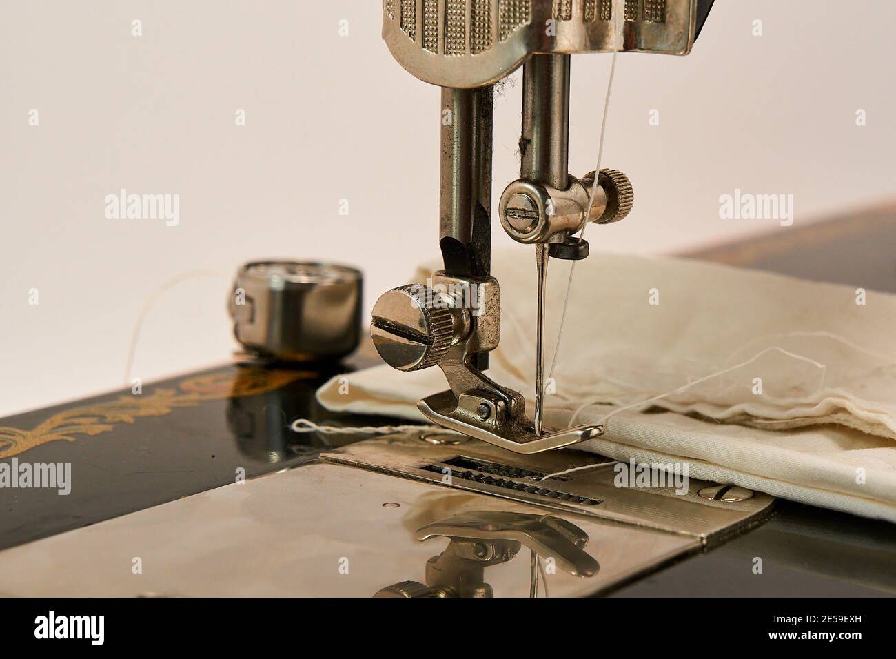 Sewing machine and parts on a white background Stock Photo - Alamy