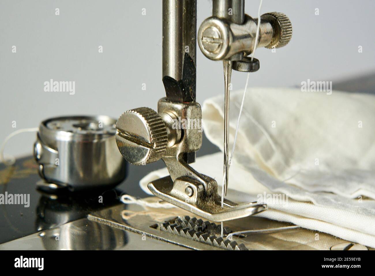 Sewing machine and parts on a white background Stock Photo - Alamy