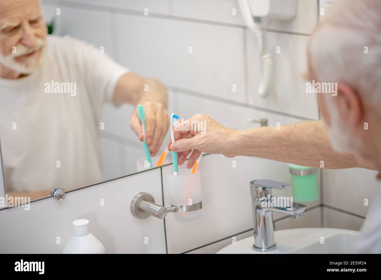 Care home washing elderly hi-res stock photography and images - Alamy