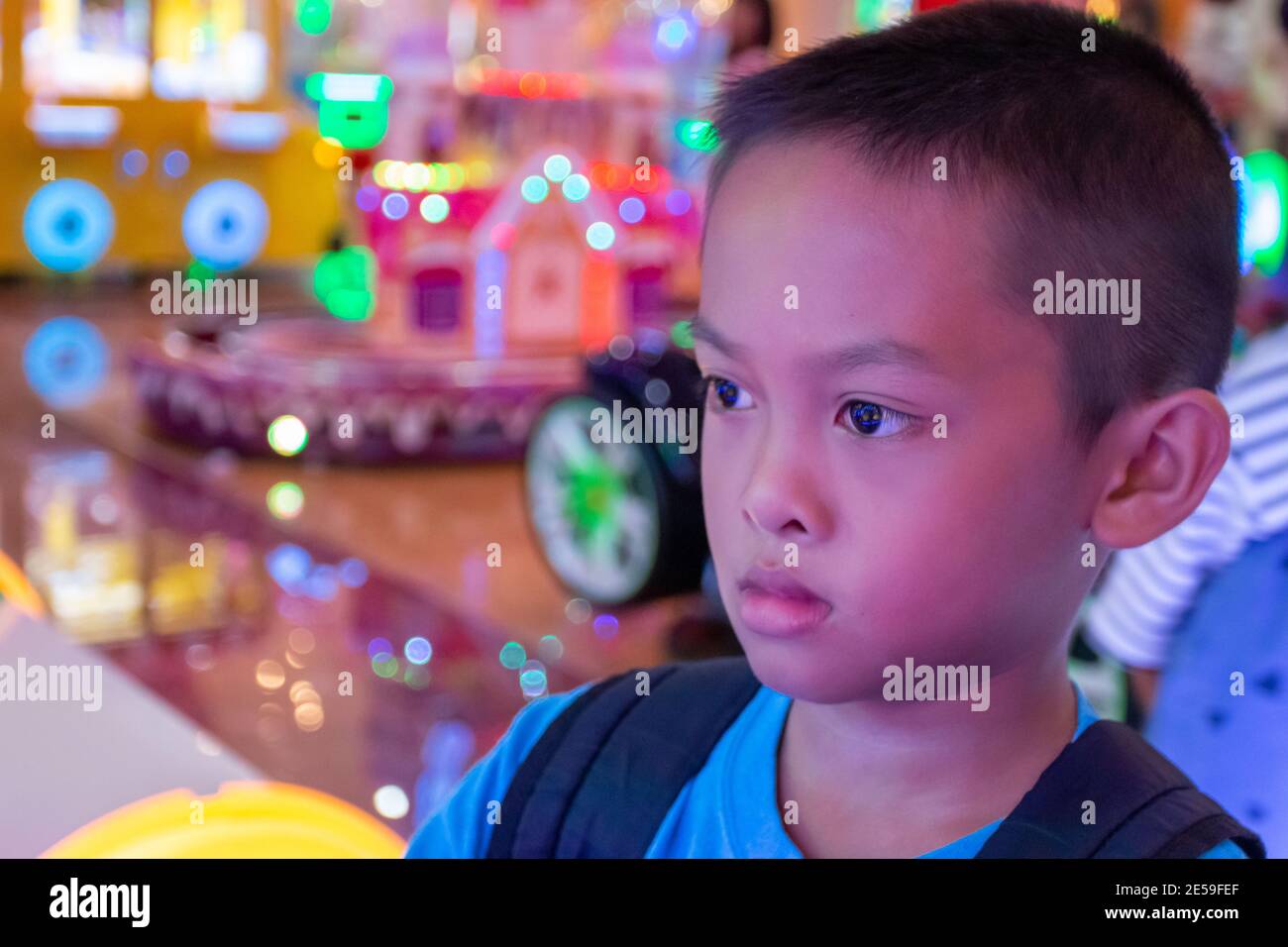 Children in shopping mall play zone with neon light Stock Photo - Alamy