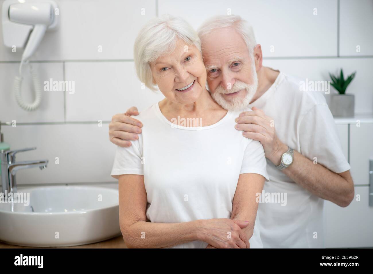 Elderly couple in the bathroom looking happy and smiling Stock Photo ...