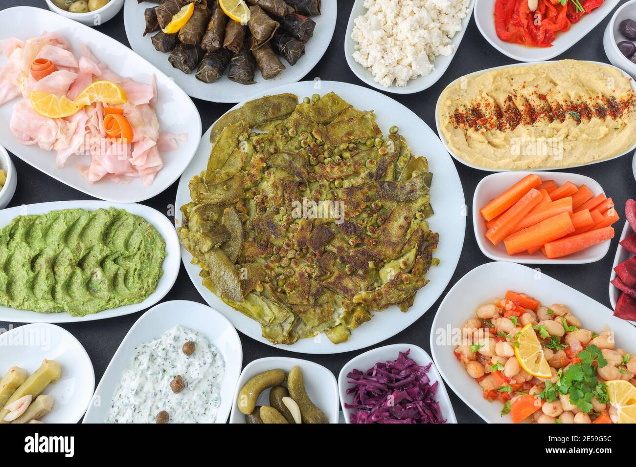 Traditional Turkish vegetable dinner meze table. Fried green beans with ...