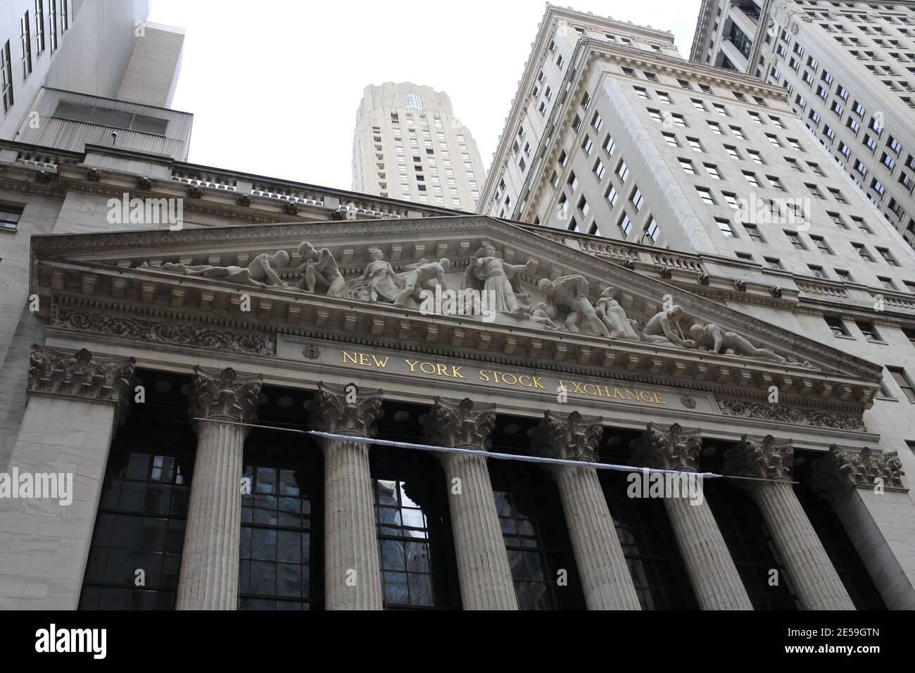 The facade of the world famous New York Stock Exchange building on Wall ...