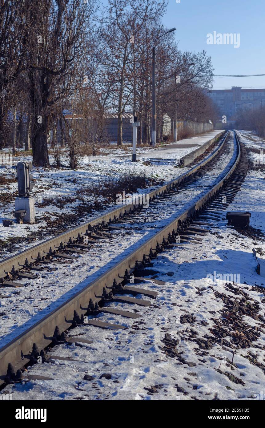 Winter Railroad in the industrial area. Empty rails with a semaphore on ...