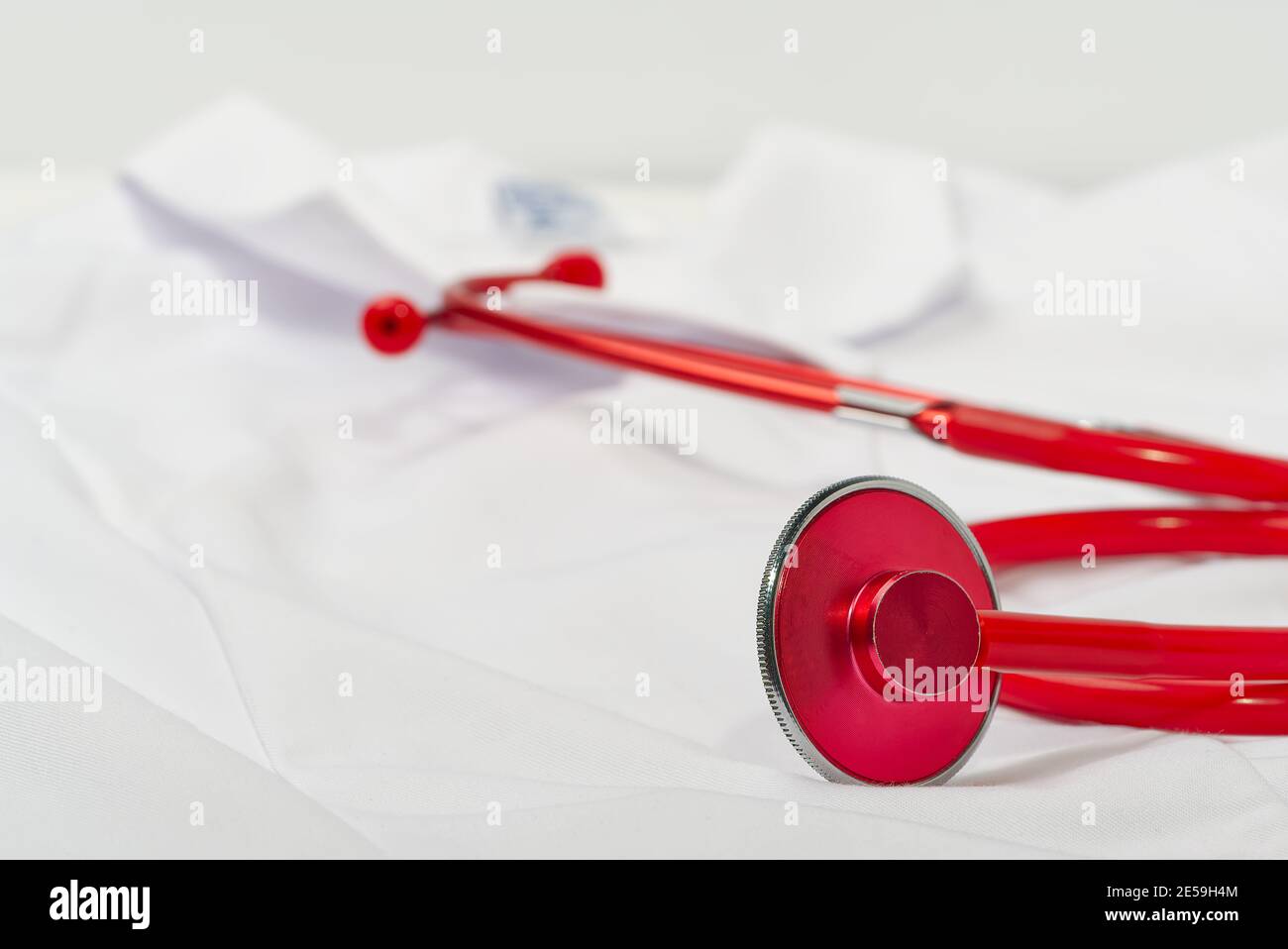 Red stethoscope on white background, close up Stock Photo - Alamy
