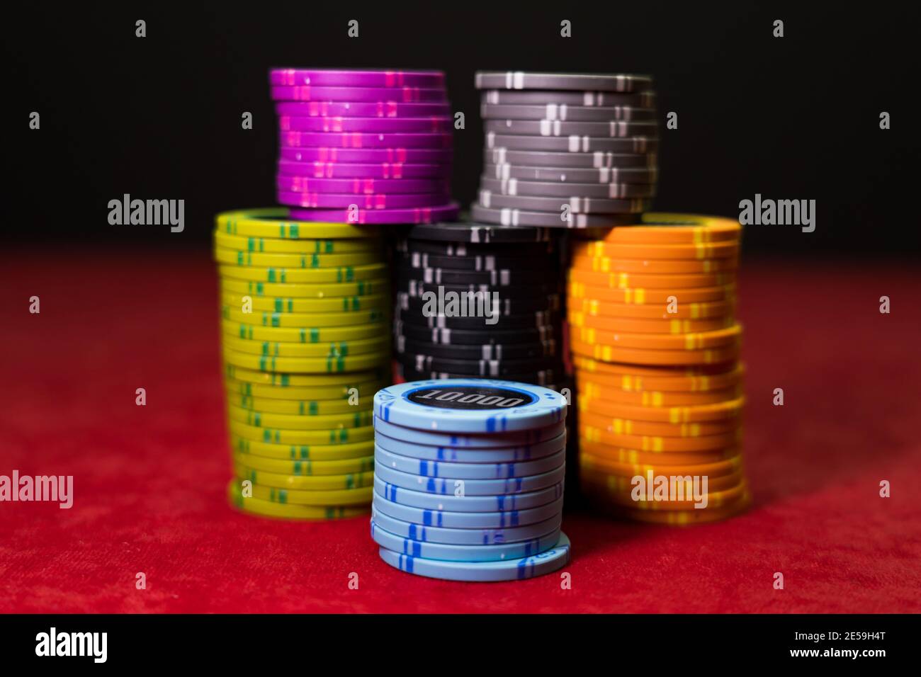 Casino chips on a gaming table Stock Photo - Alamy