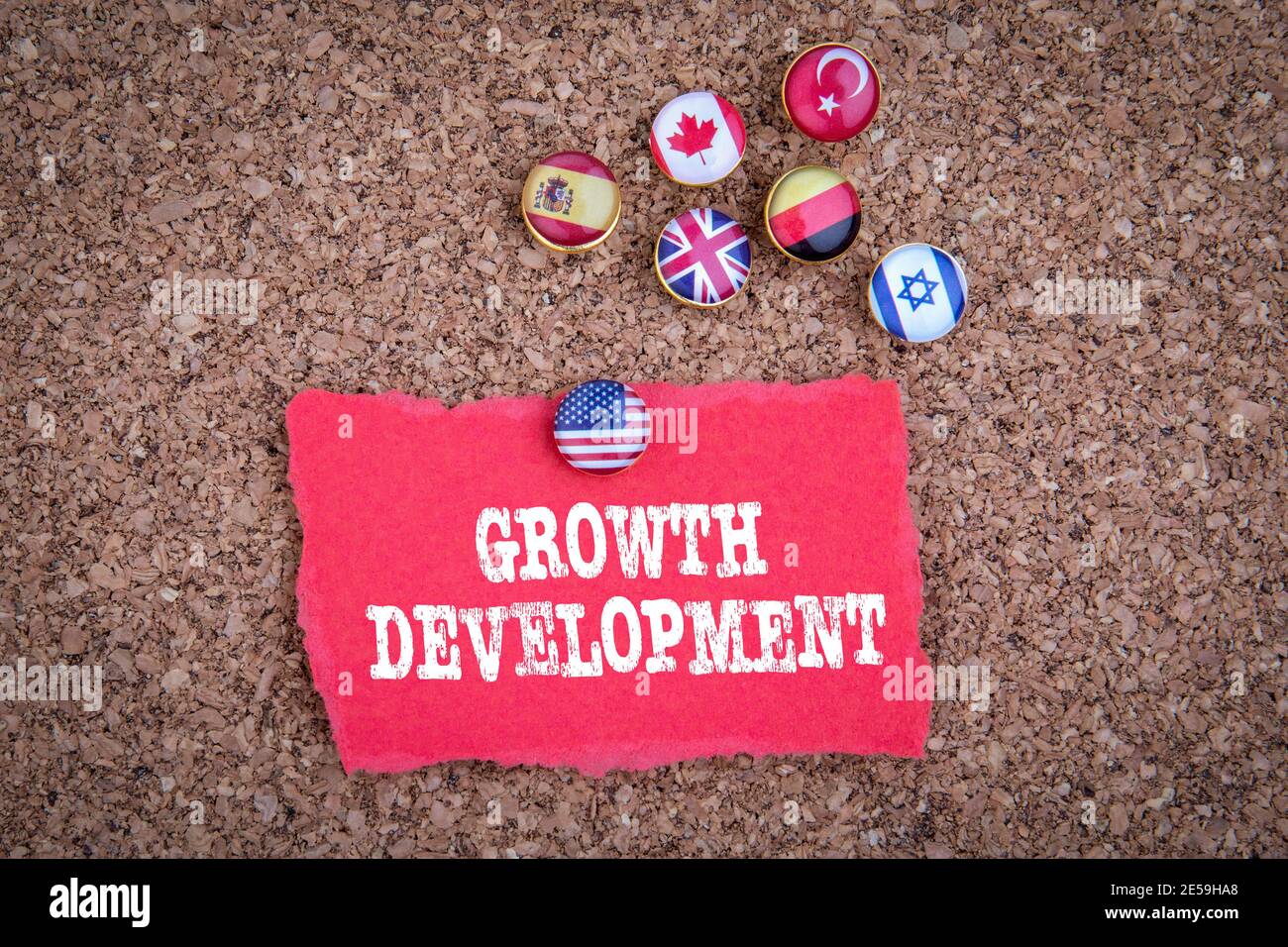 Growth and Development concept. Sticky note pinned to a cork background ...
