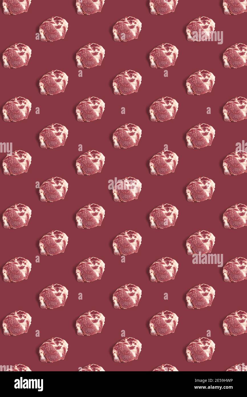 background with raw pork meat slices on red background, raw food ...